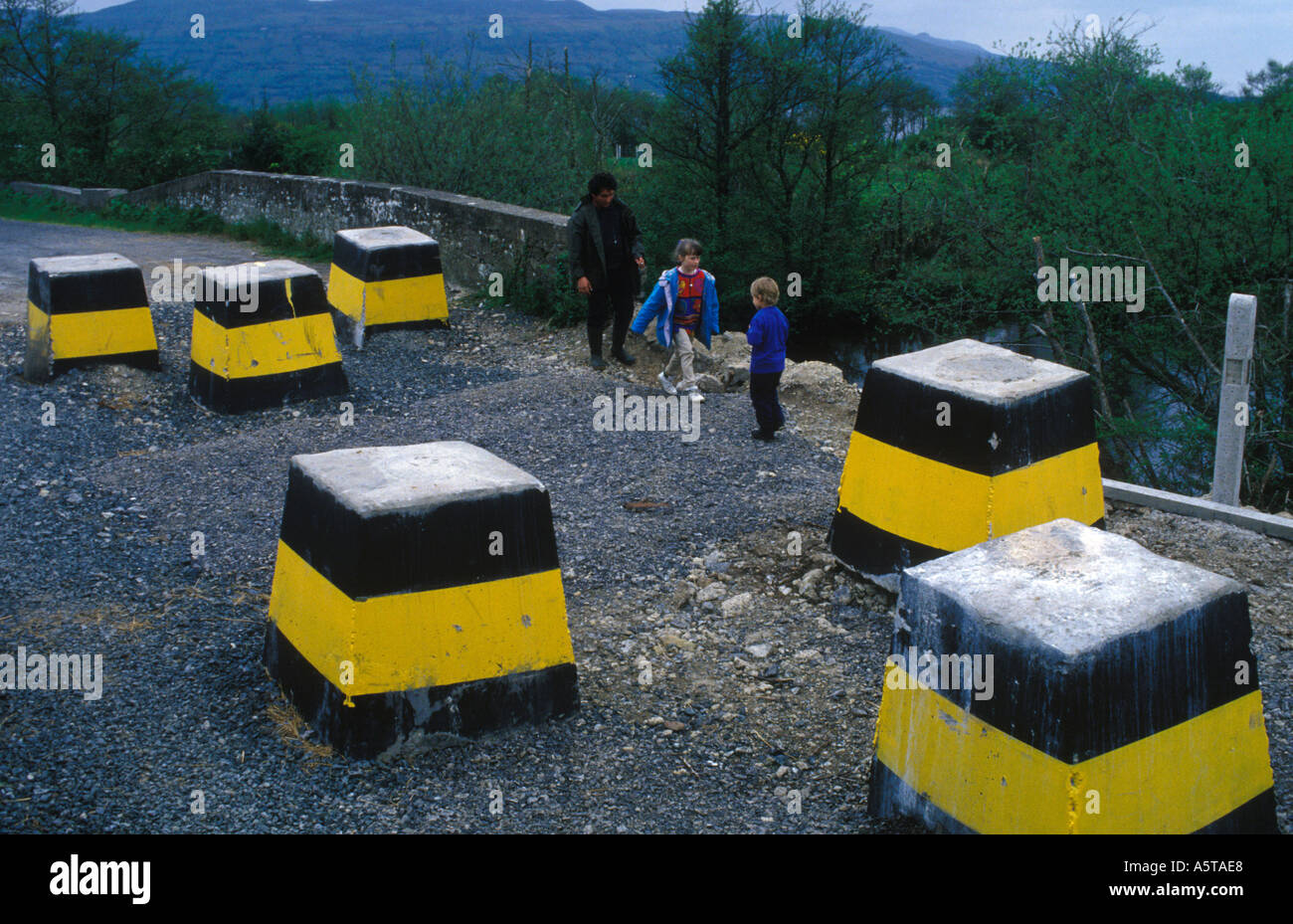 An Irish family pass through a roadblock set up by the British Army on ...