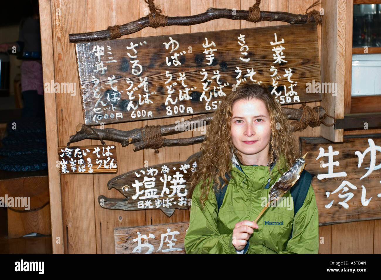 Girl eating trout in Nikko, Japan, Asia Stock Photo - Alamy
