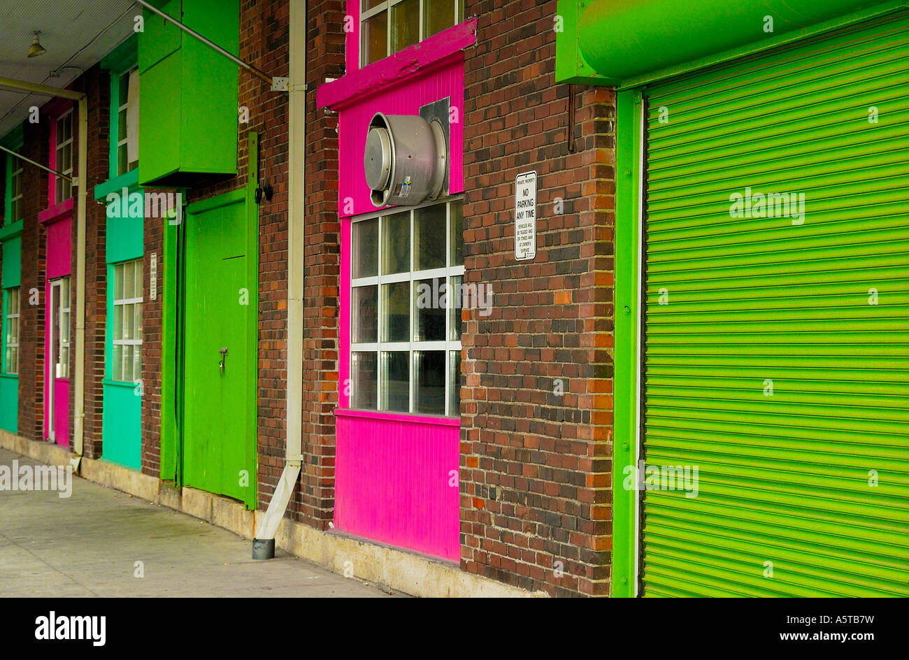Brightly colored doors on side of building Stock Photo - Alamy