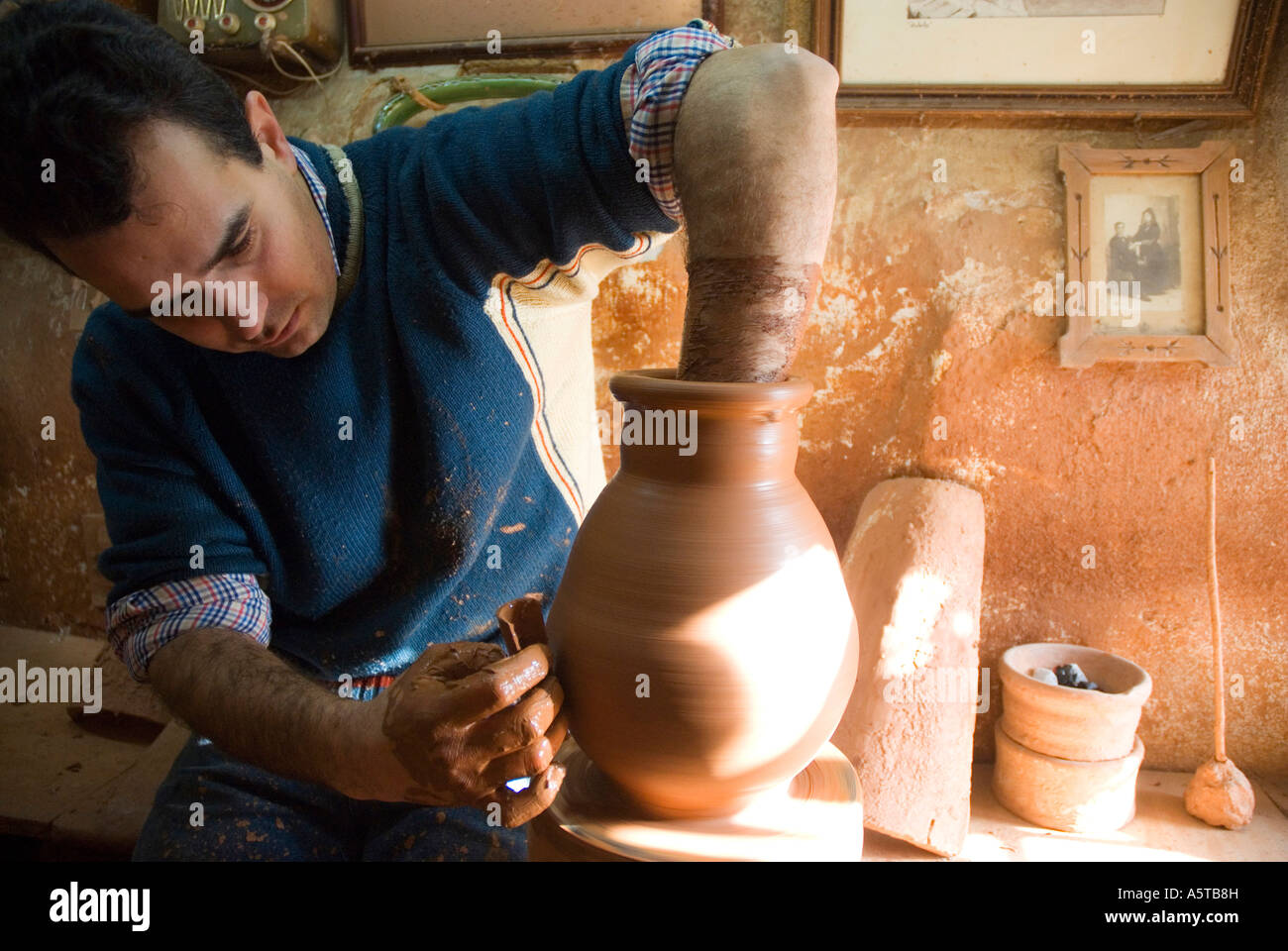 Paco Tito and Son Pottery Museum / Pablo working on a earthenware jar ...