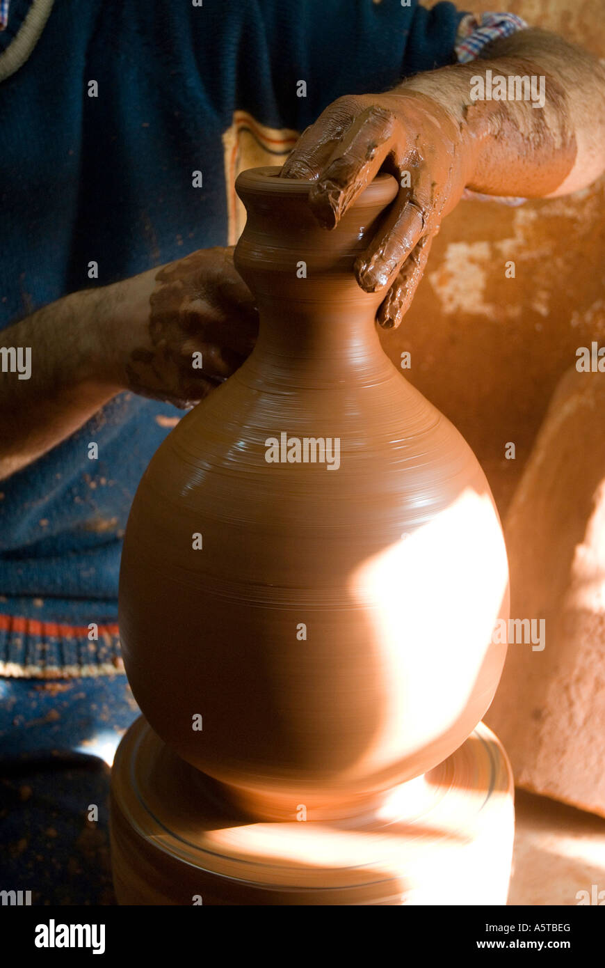 Paco Tito and Son Pottery Museum Pablo working on a earthenware jar ...