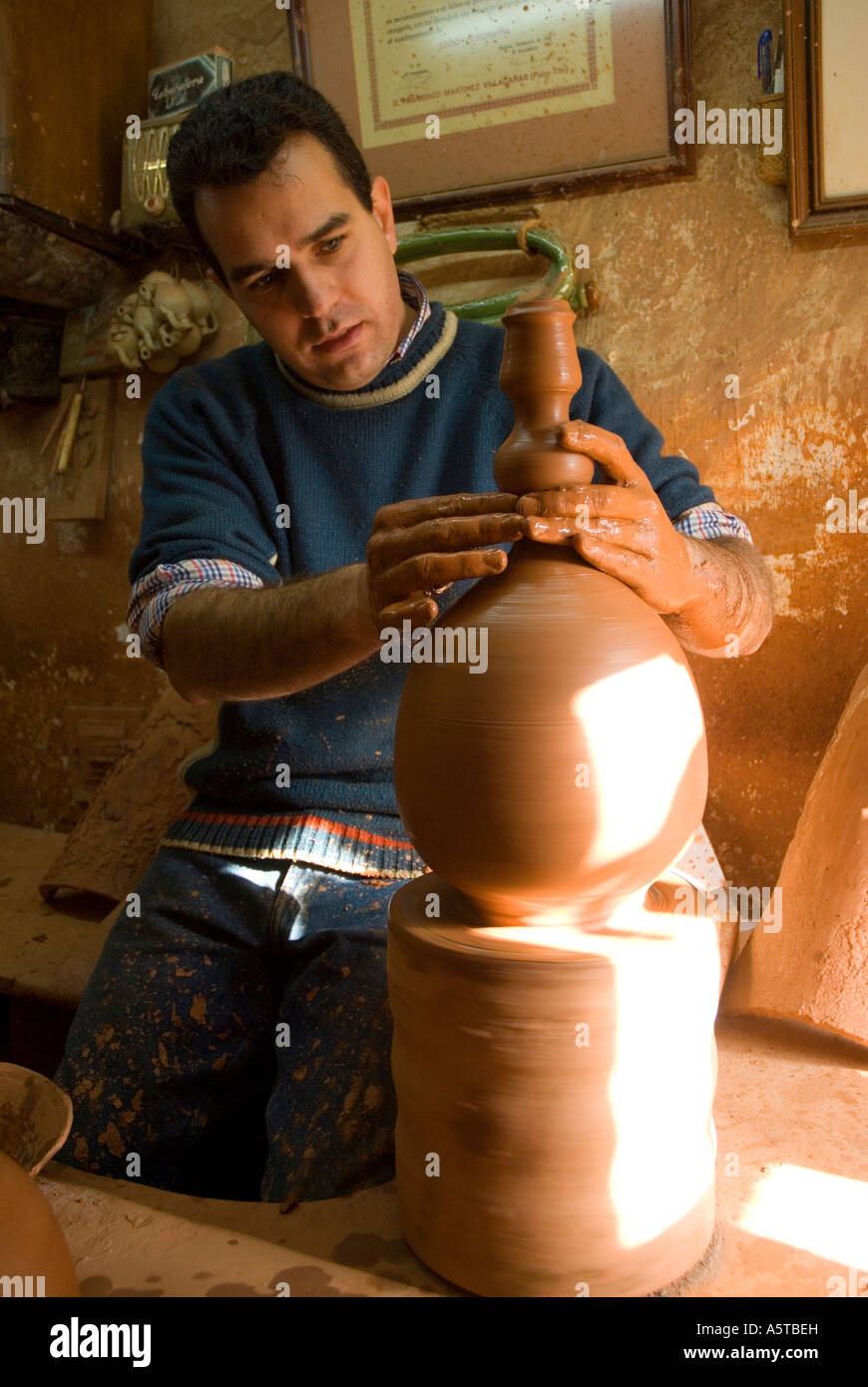 Paco Tito and Son Pottery Museum / Pablo working on a earthenware jar ...