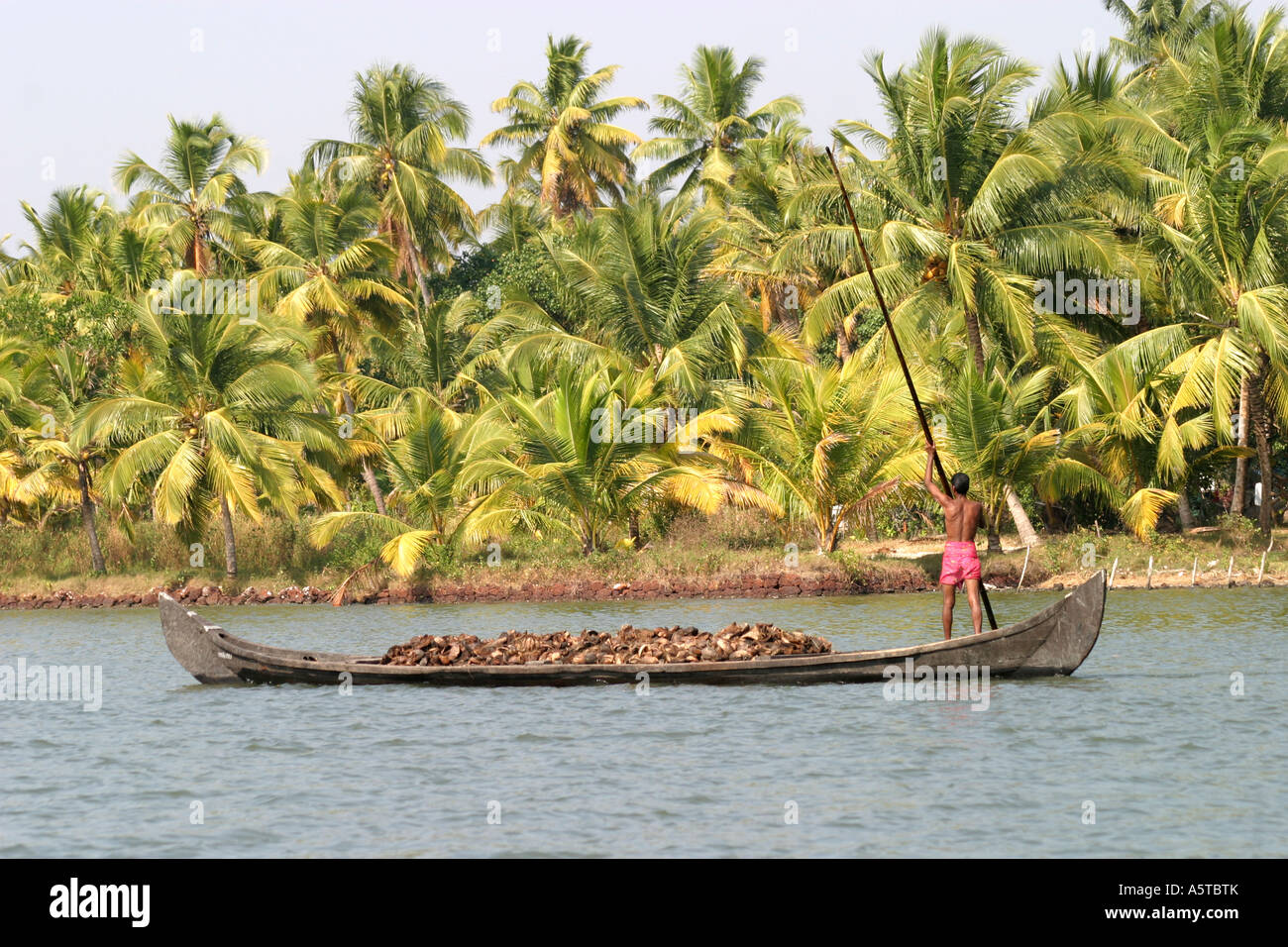 Heavily laden barge on the Kerala backwaters of Kerala Southern India ...