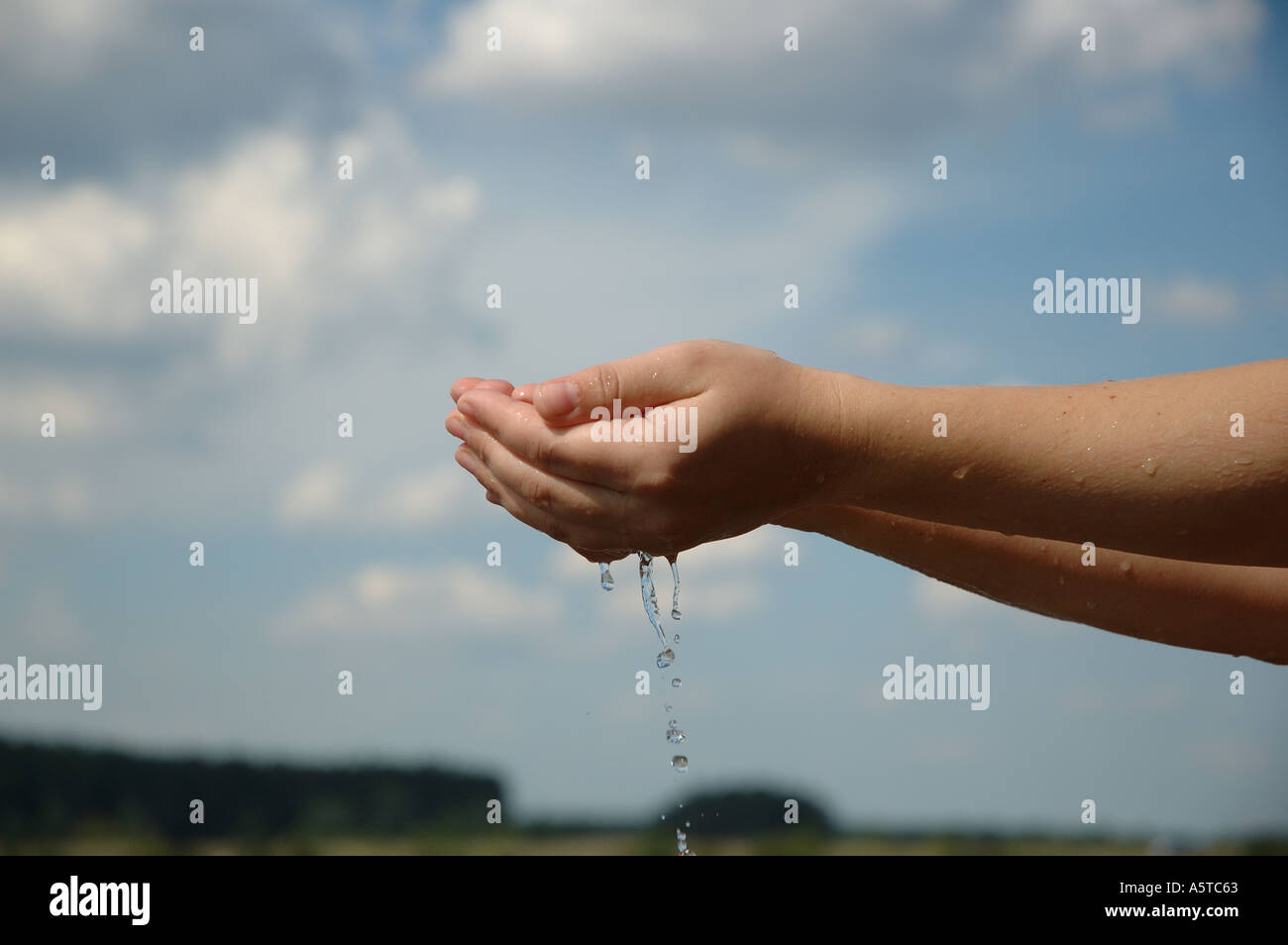 Hands in water Stock Photo - Alamy