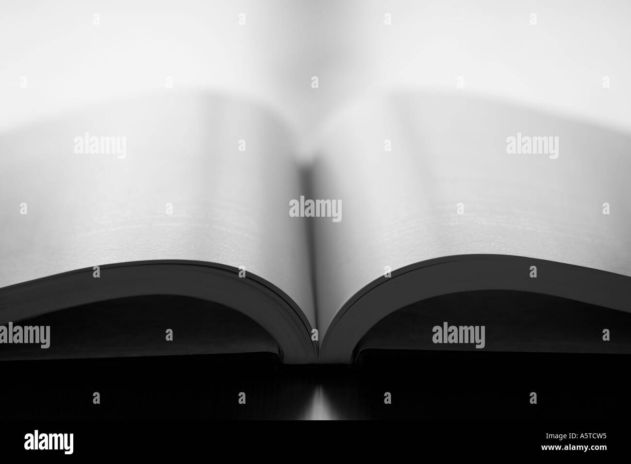 Open Book On Table Stock Photo - Alamy