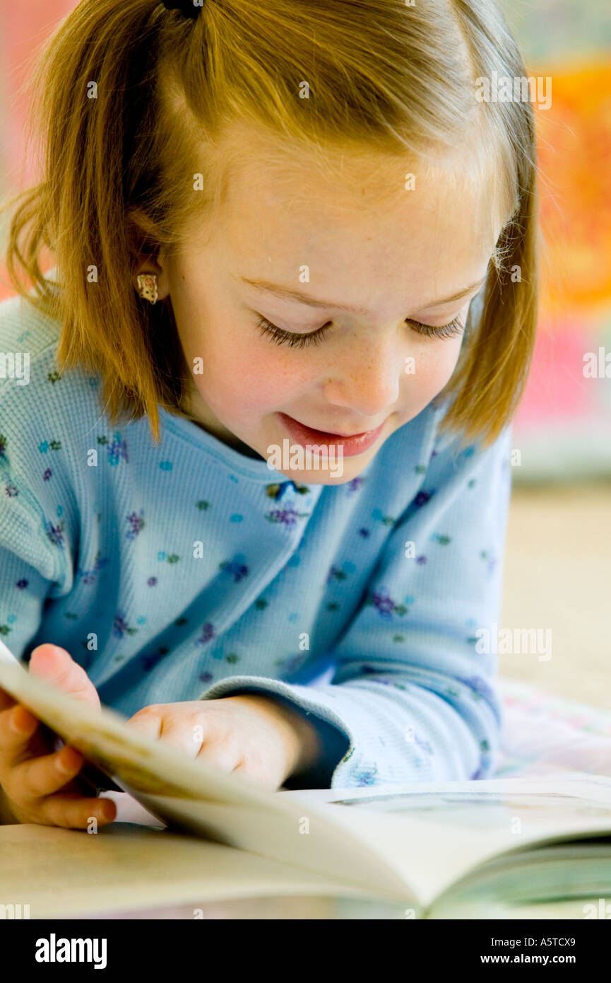 Kid Enjoying Reading Stock Photo - Alamy