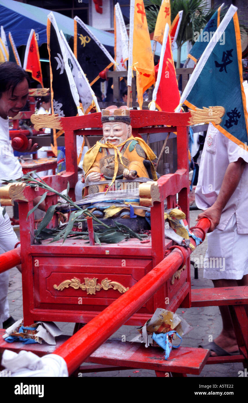 A statue of one of the nine emperor gods carried through Phuket Town ...