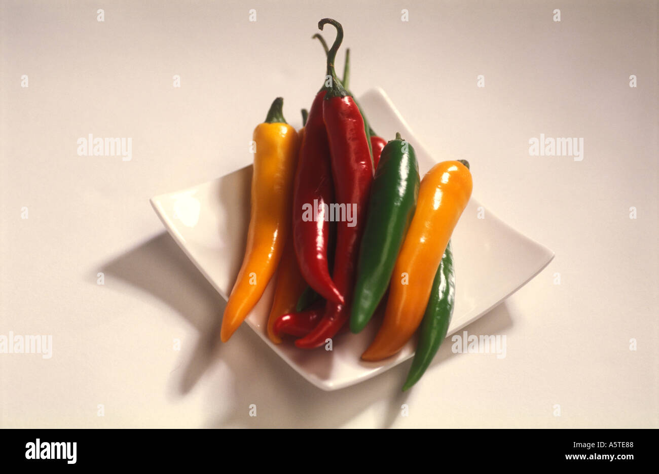 red green yellow chilli peppers tri multi 3312 Stock Photo - Alamy