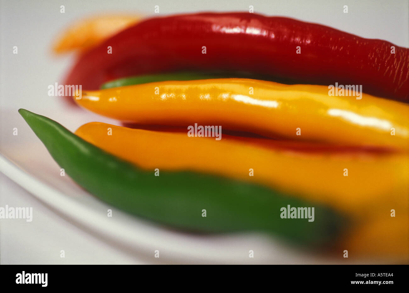red green yellow chilli peppers tri multi 3312 Stock Photo - Alamy