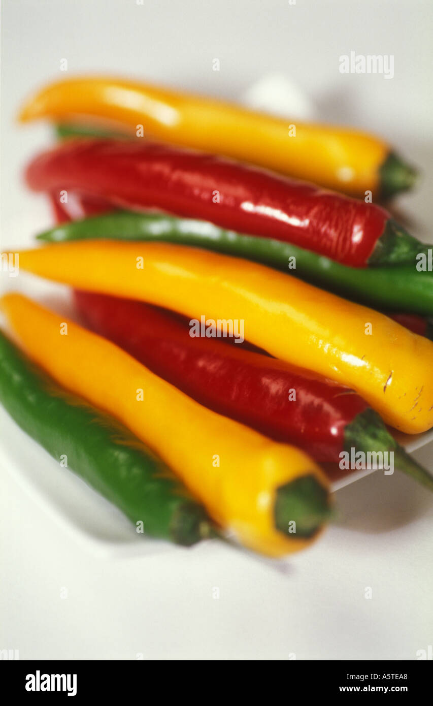red green yellow chilli peppers tri multi 3312 Stock Photo - Alamy