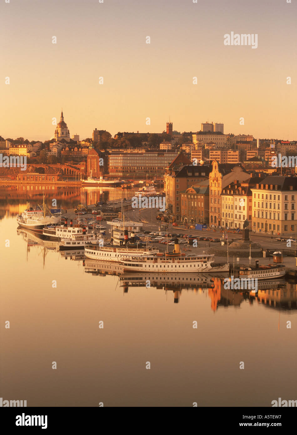 Ferryboats moored along Skeppsbron in Stockholm at sunrise Stock Photo ...
