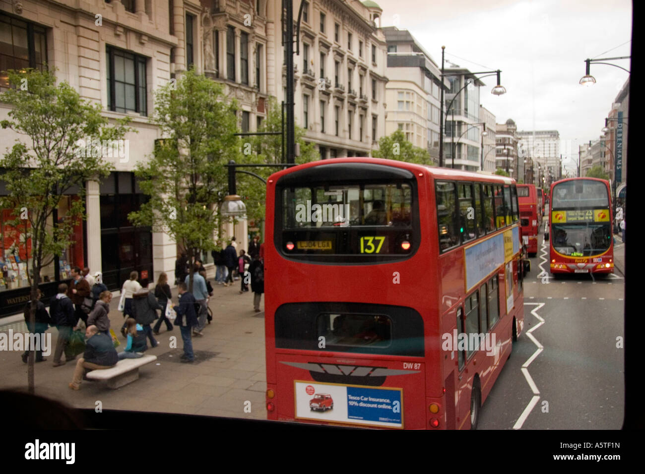 view of a red old style bus ride commute commuter London Britain UK ...