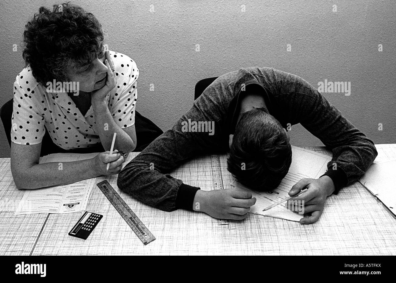 A young student shows his frustration during a one to one teaching ...