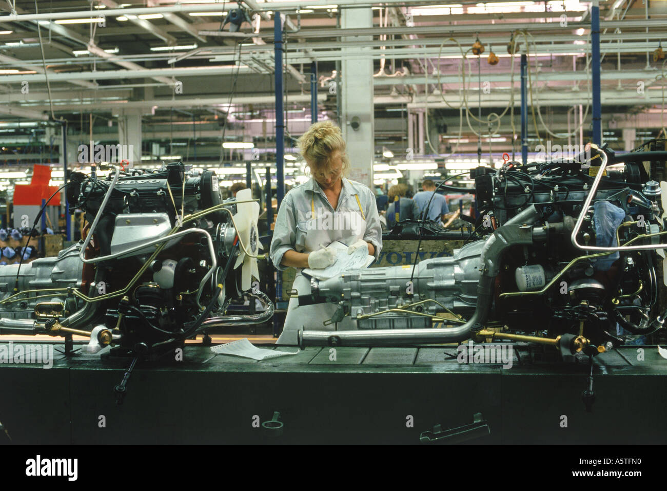 Woman working on engine assembly line at Volvo Torslanda Plant near ...