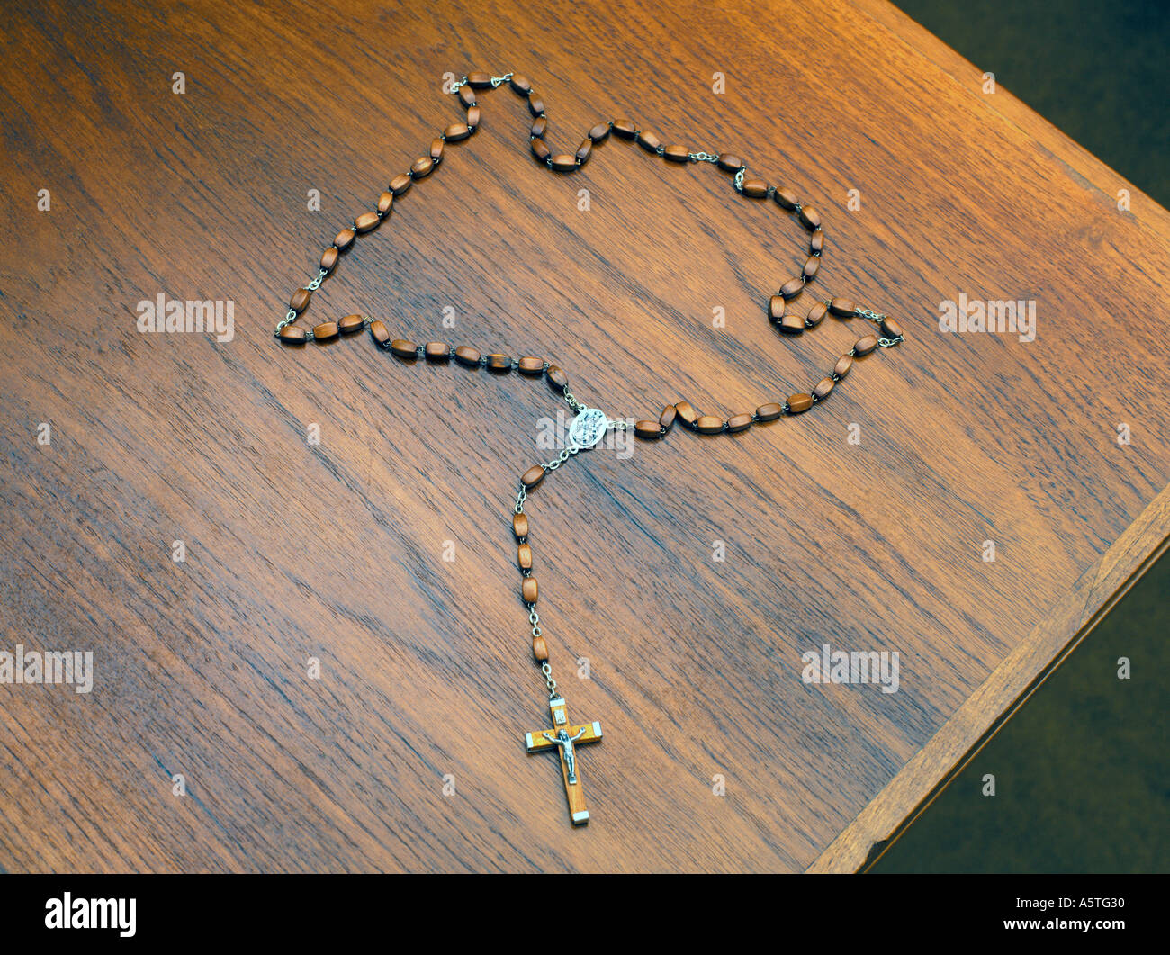 Rosary on Table Stock Photo - Alamy