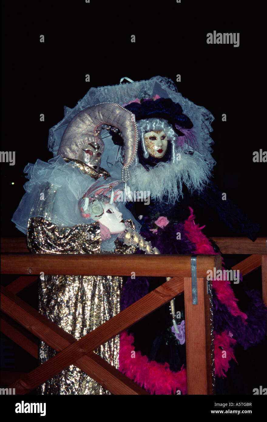 Carnival characters by canal Venice carnival Italy Stock Photo - Alamy
