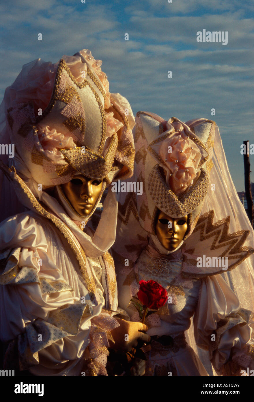 Carnival characters by canal Venice carnival Italy Stock Photo - Alamy