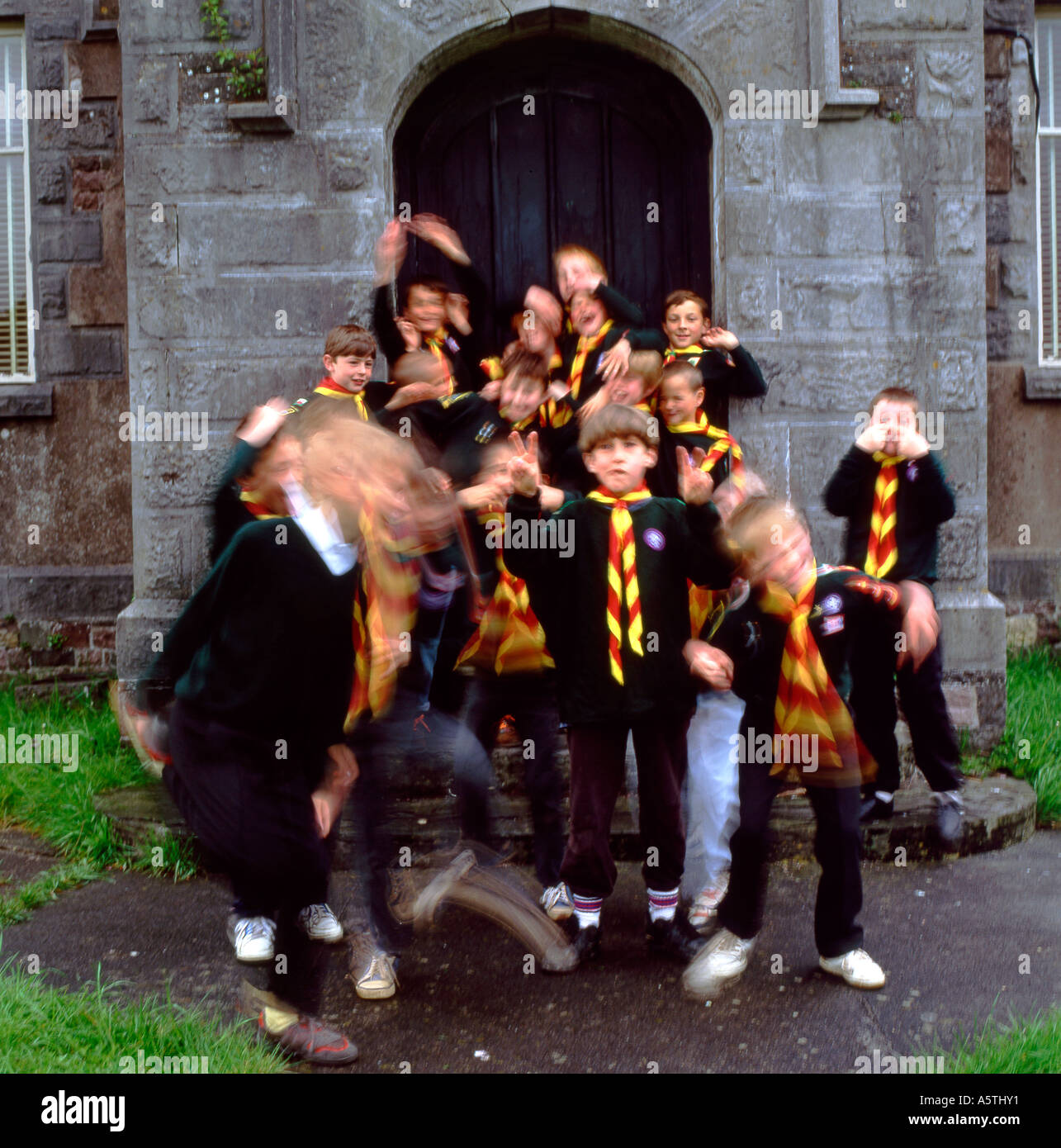 Cub scouts having fun going wild pandemonium posing for a group ...