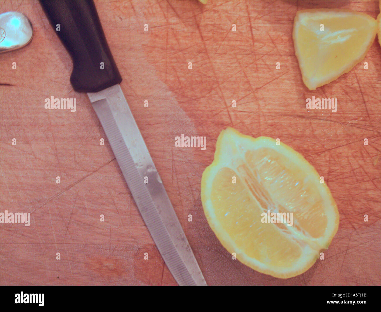 Lemon sliced and kitchen knife Stock Photo - Alamy