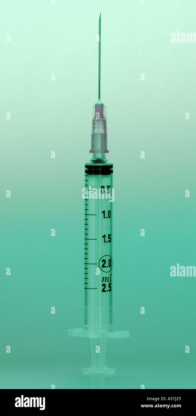 A Syringe green hue medical Stock Photo - Alamy