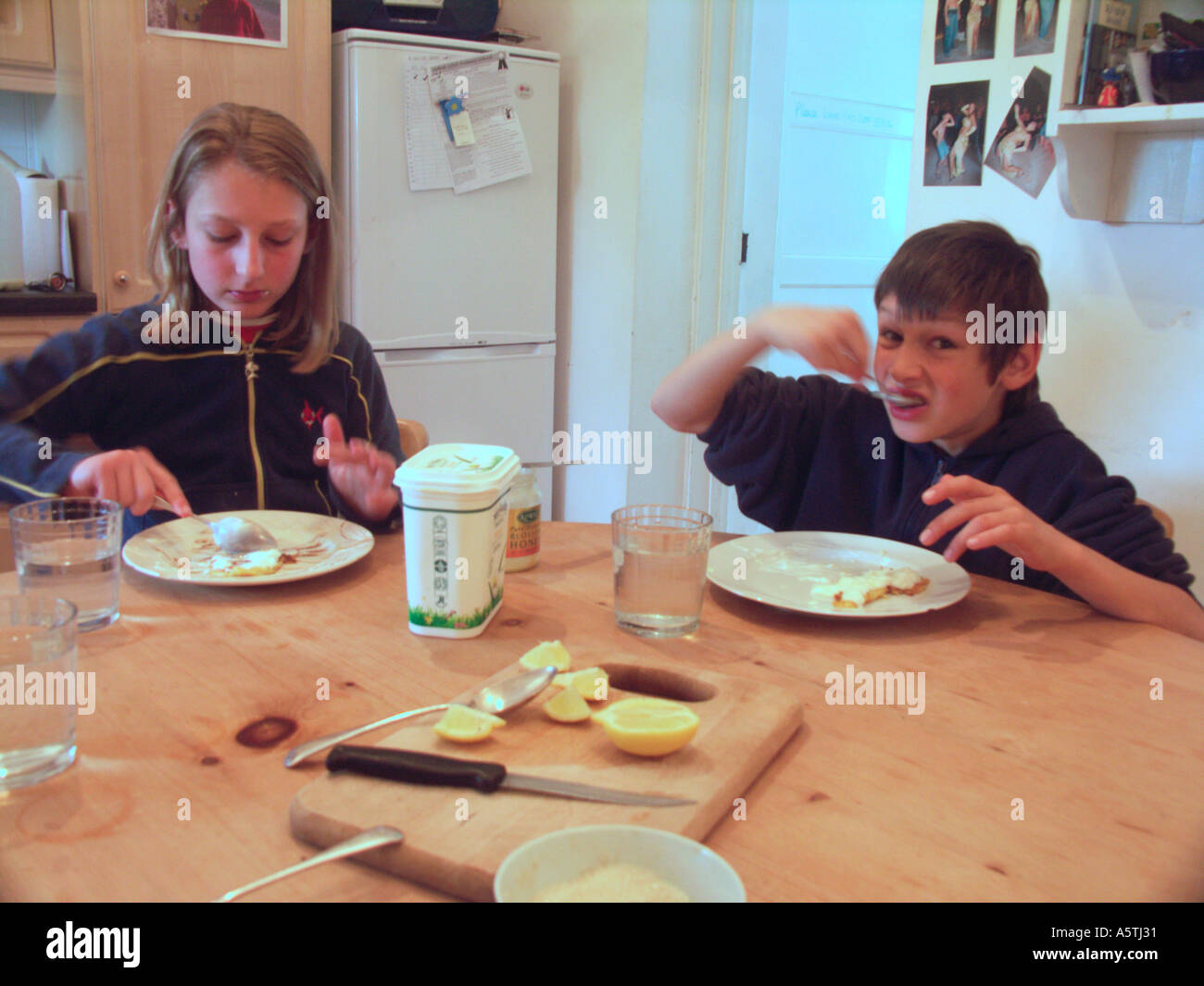 Twins eating breakfast hi-res stock photography and images - Alamy
