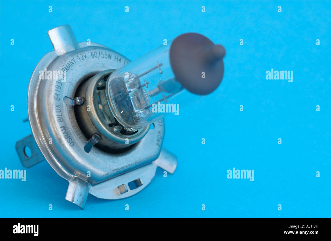 Car headlamp bulb on blue background Stock Photo - Alamy