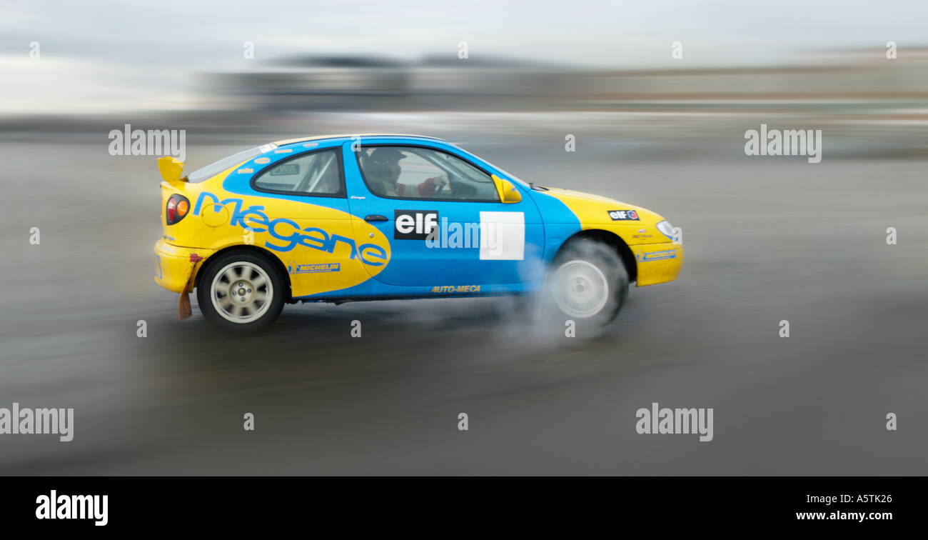 Rally Car performing stunt skids on track with pan blur Renault ...