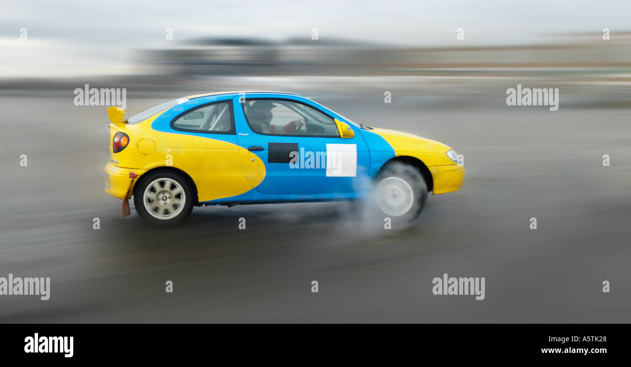 Rally Car performing stunt skids on track with pan blur Branding ...