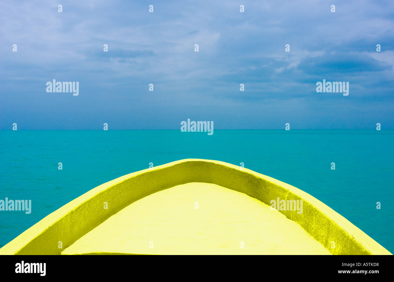 Yellow boat against turquoise water Ascencion Bay Punta Allen Mexico ...