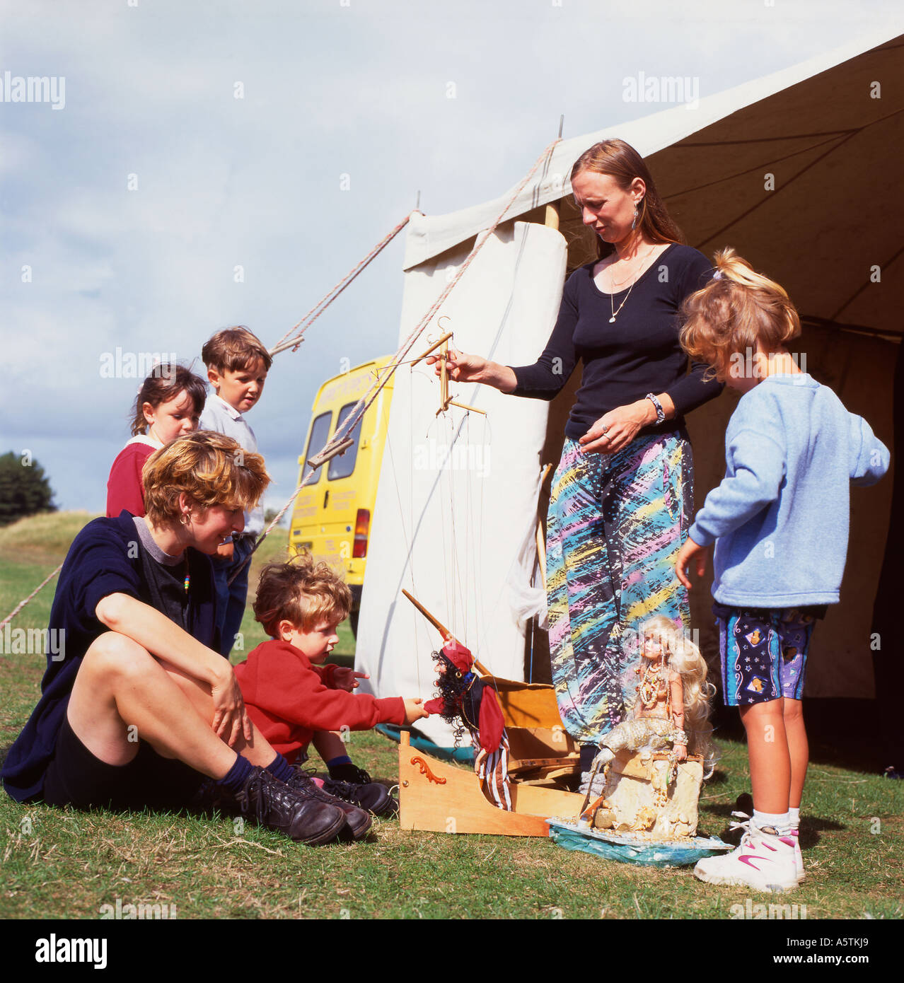 A child shaking hands with a handmade pirate puppet Wales UK Stock ...