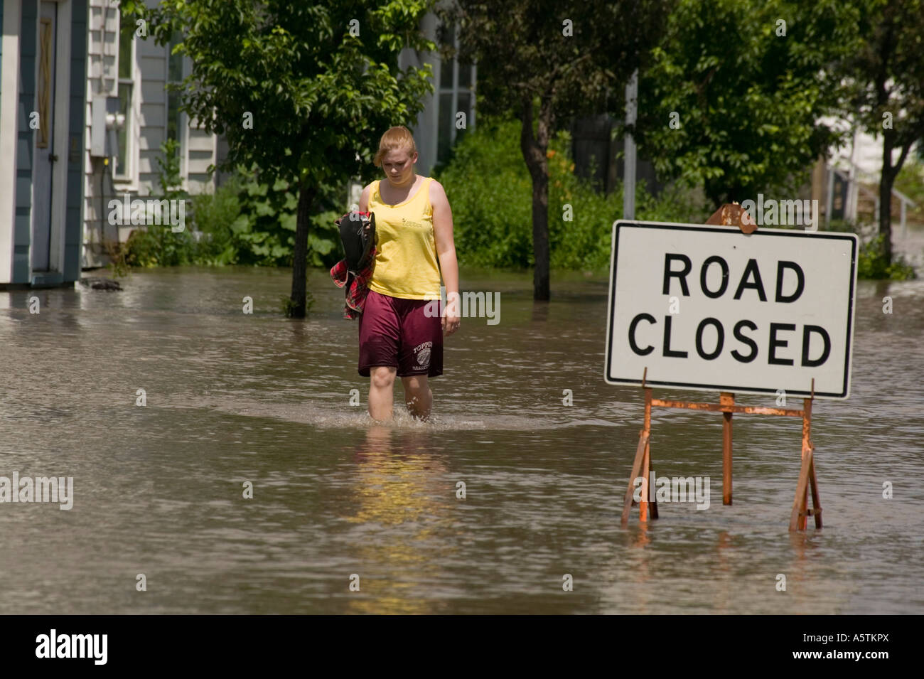 Woman wading through river hi-res stock photography and images - Alamy