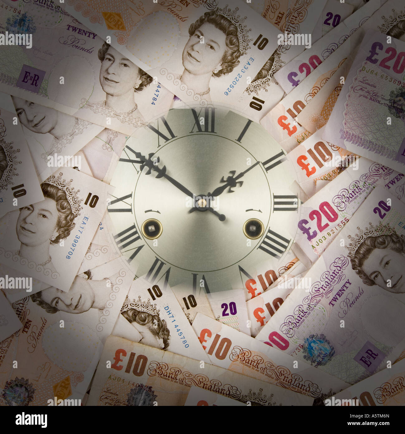 Scattered used 10 and 20 pound bank notes with a clock face Concept of ...