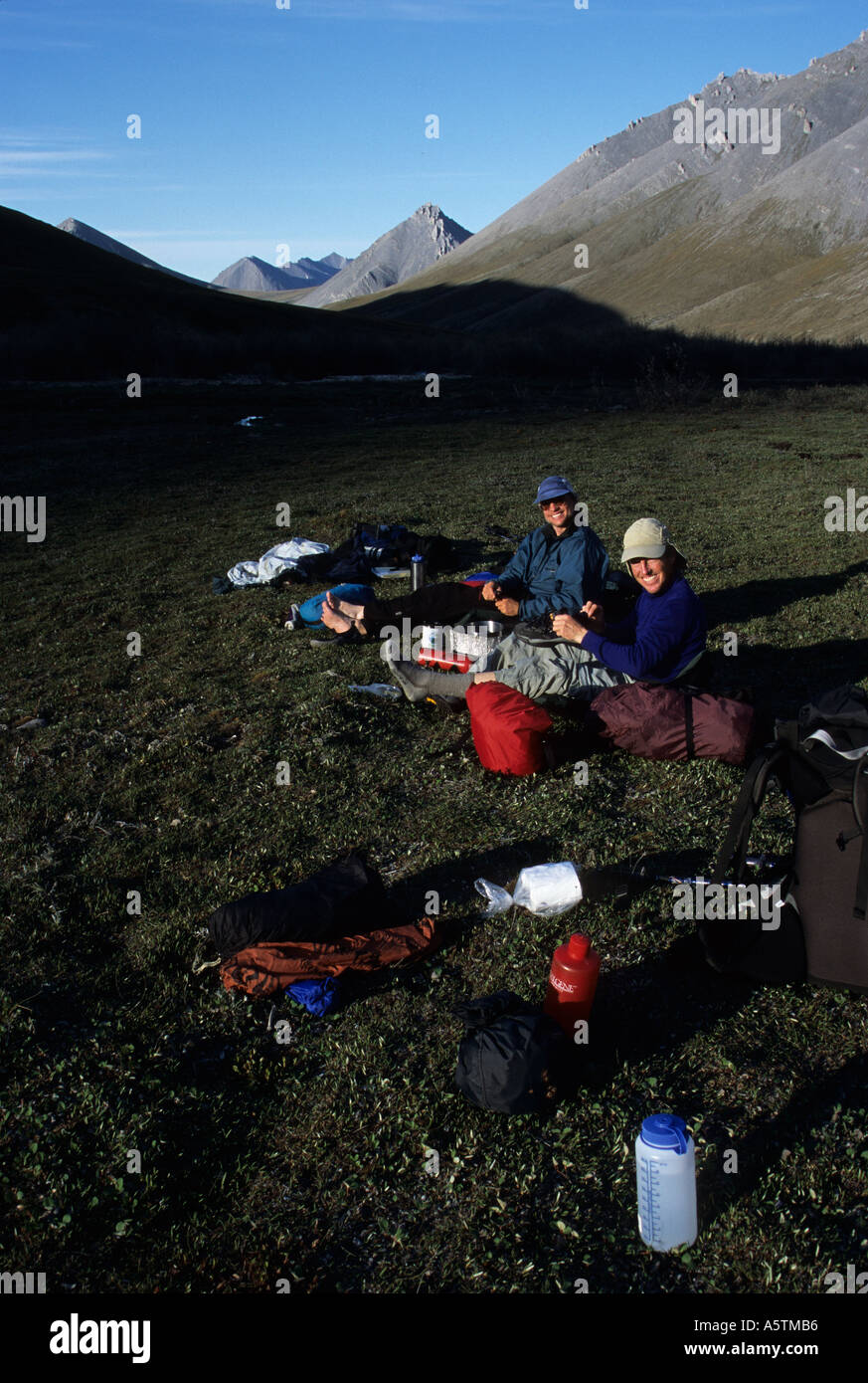 Alaska Arctic National Wildlife Refuge Hikers relaxing on the tundra in ...