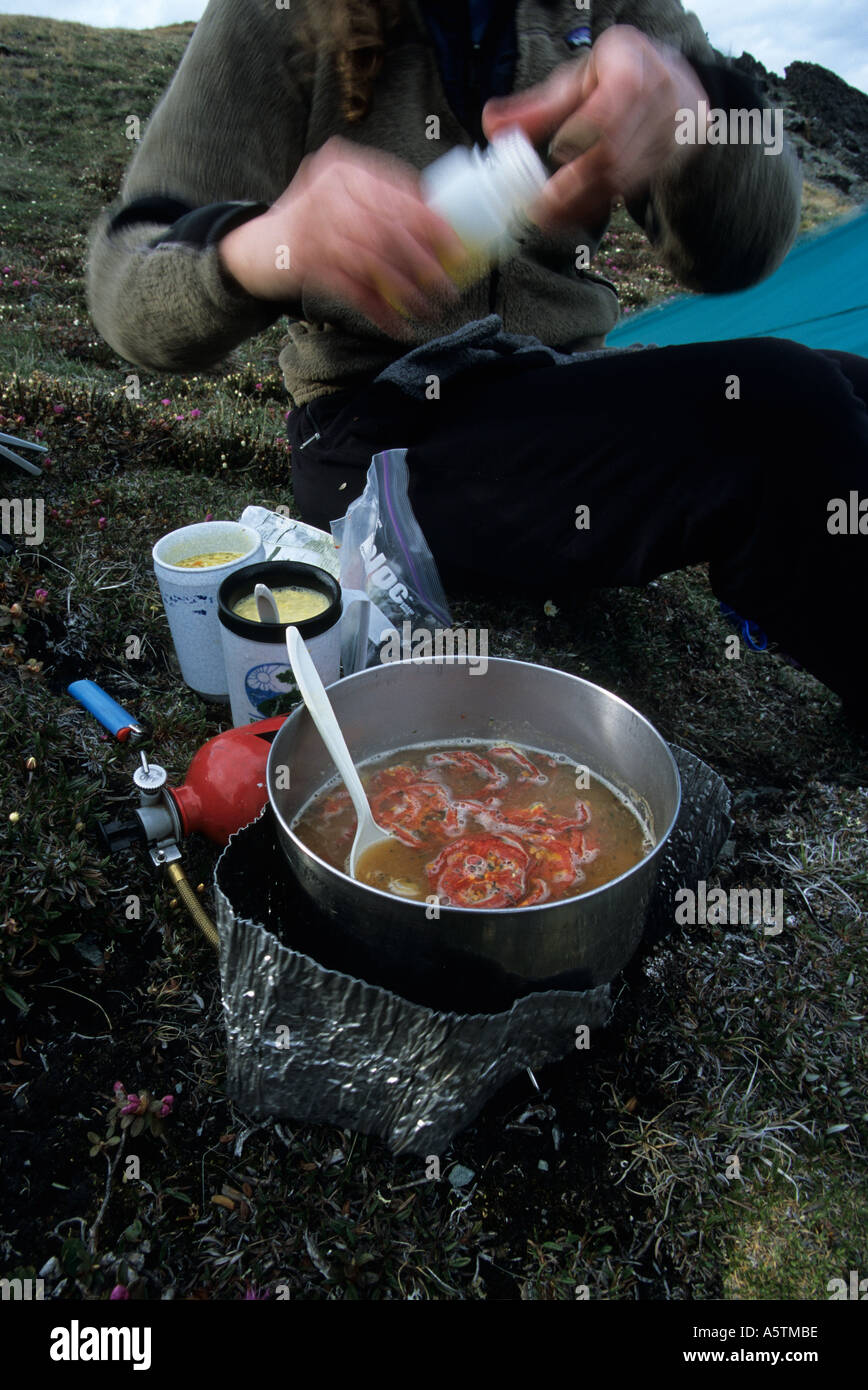 Alaska Arctic National Wildlife Refuge Preparing dinner on a camping ...