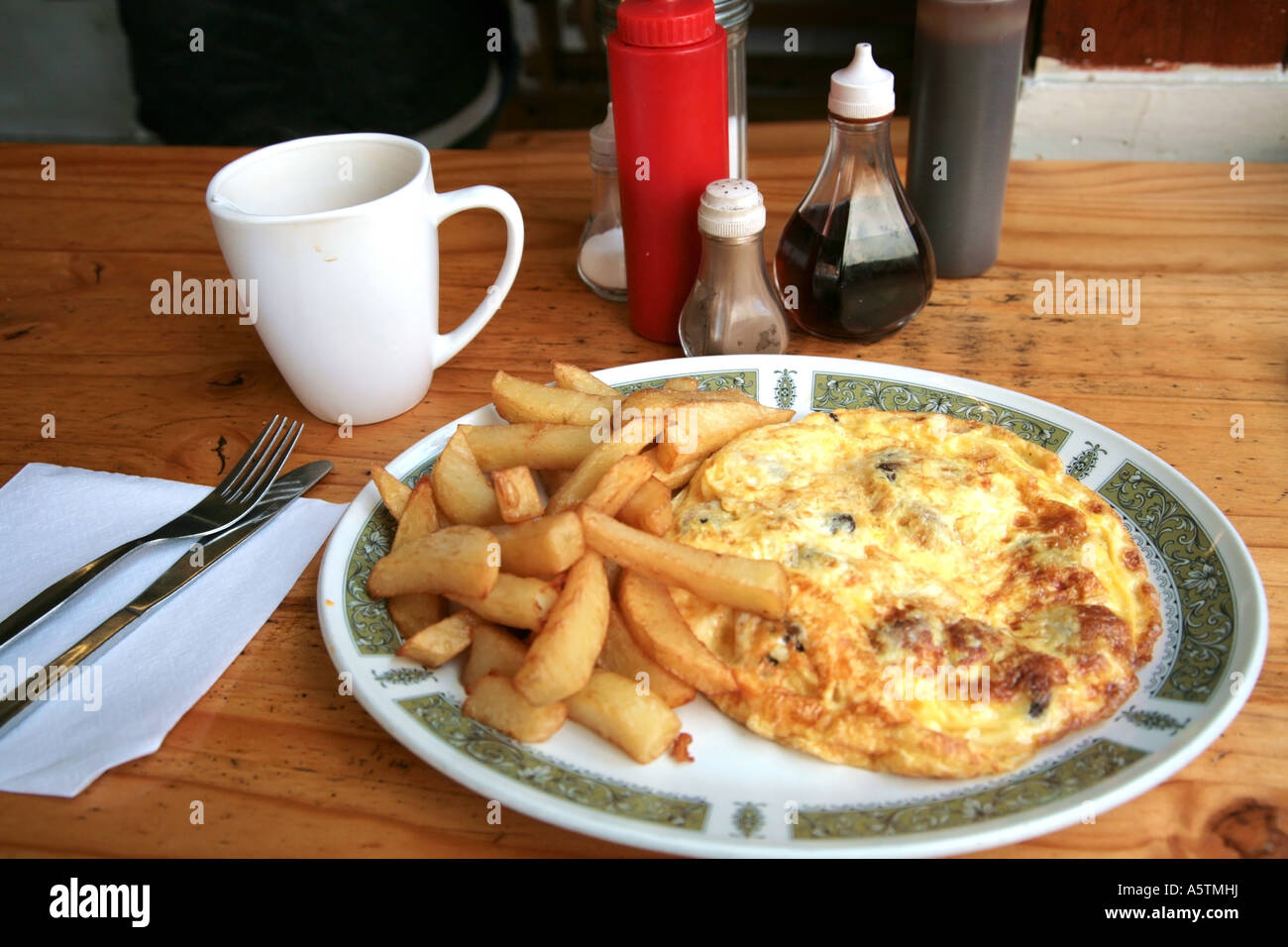 omelette and chips in cheap cafe Stock Photo - Alamy