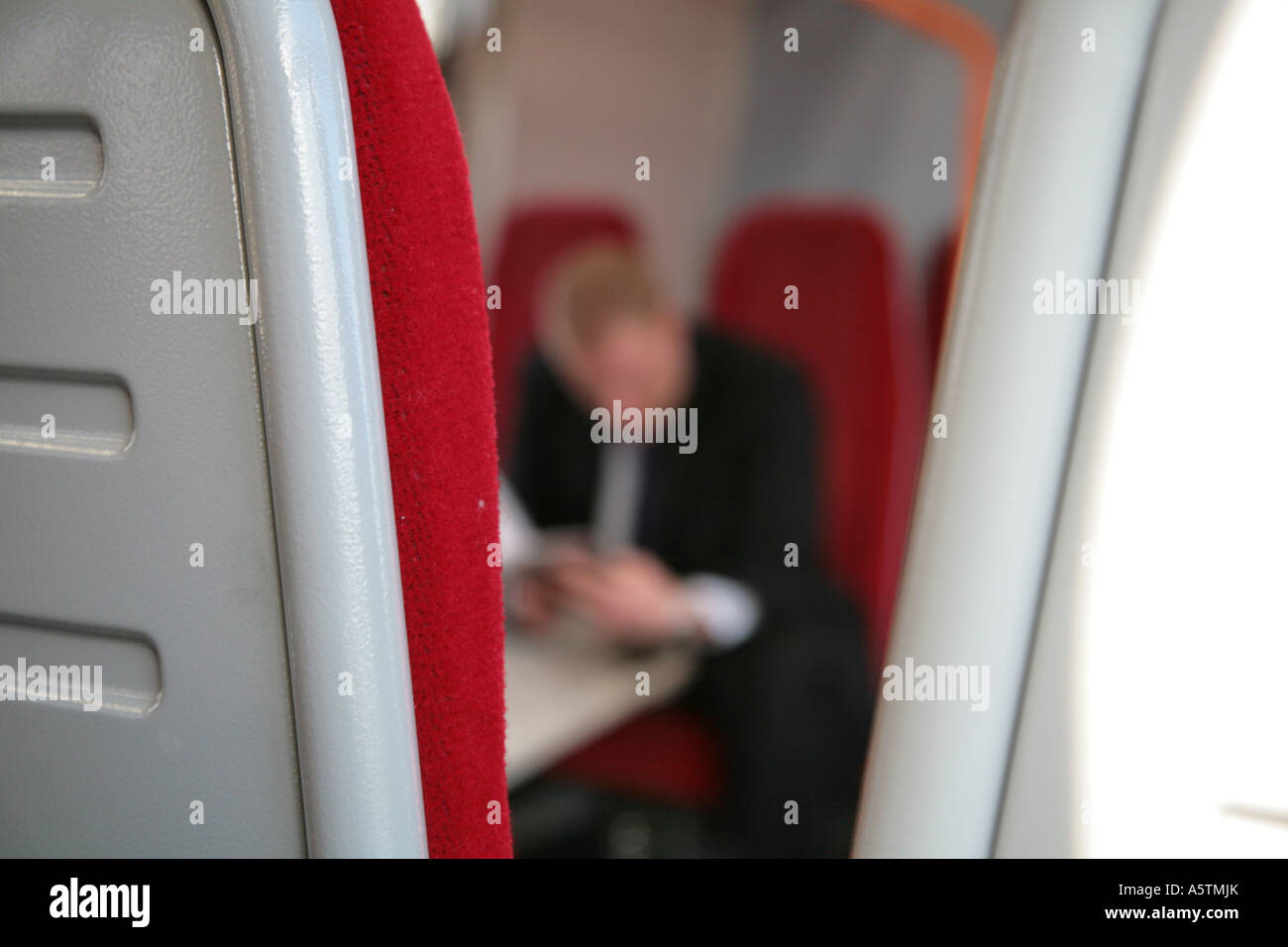 man reading on train Stock Photo - Alamy