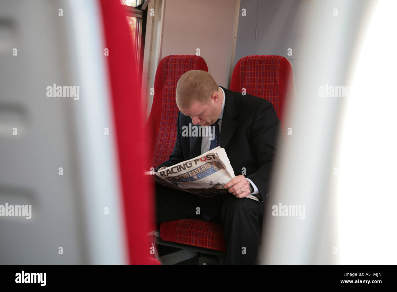Reading the racing post hi-res stock photography and images - Alamy