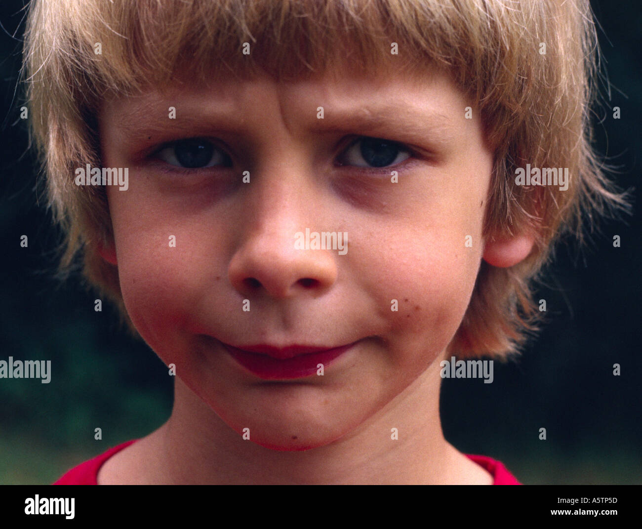 MR fair haired boy looking defiantly Stock Photo - Alamy
