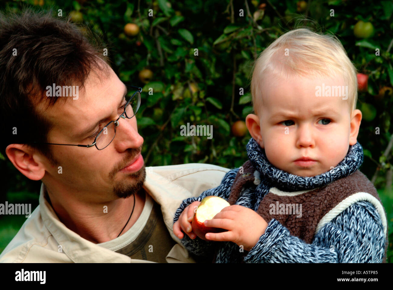 Child eating apple from tree hi-res stock photography and images - Alamy