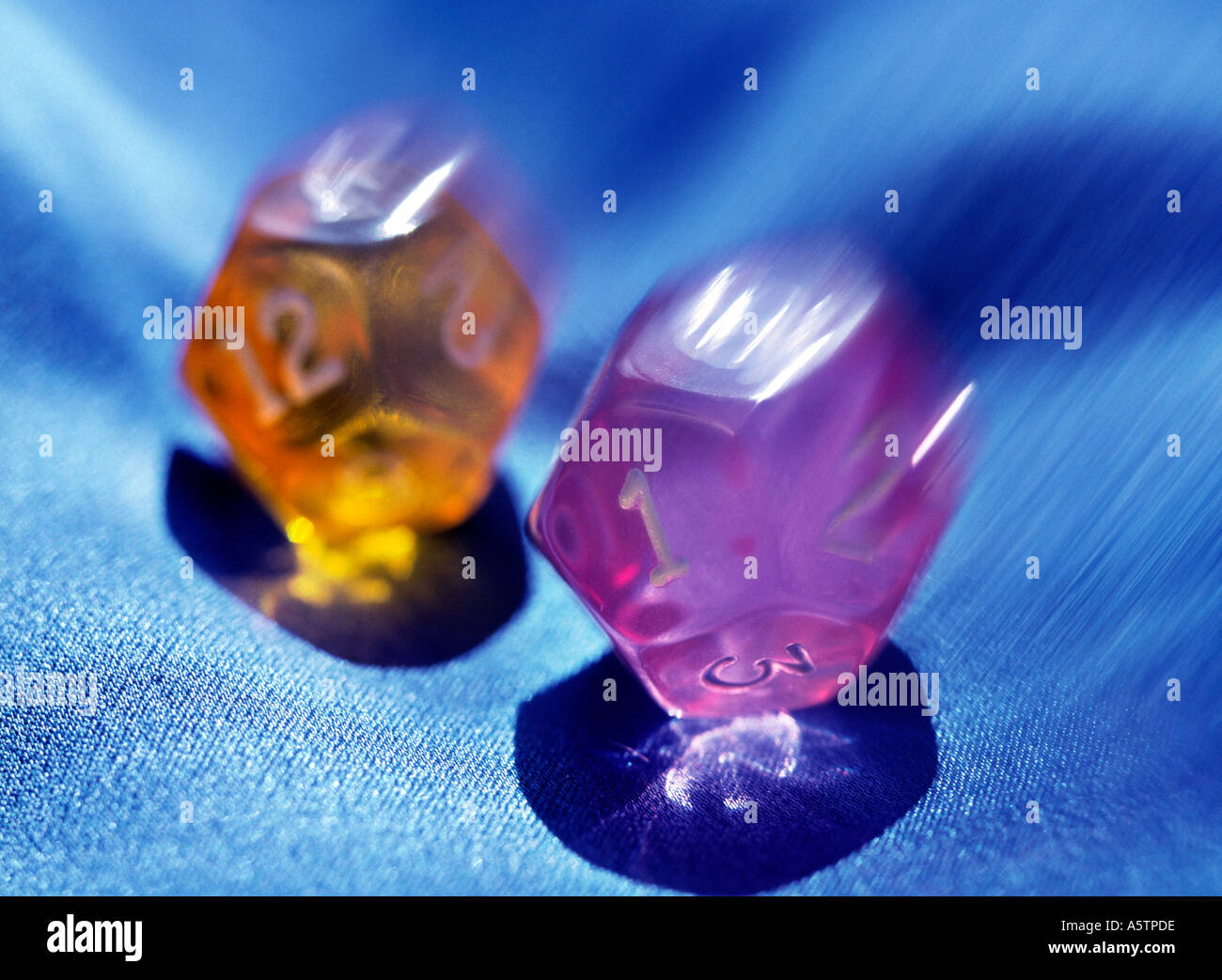 two transparent coloured dice Stock Photo - Alamy