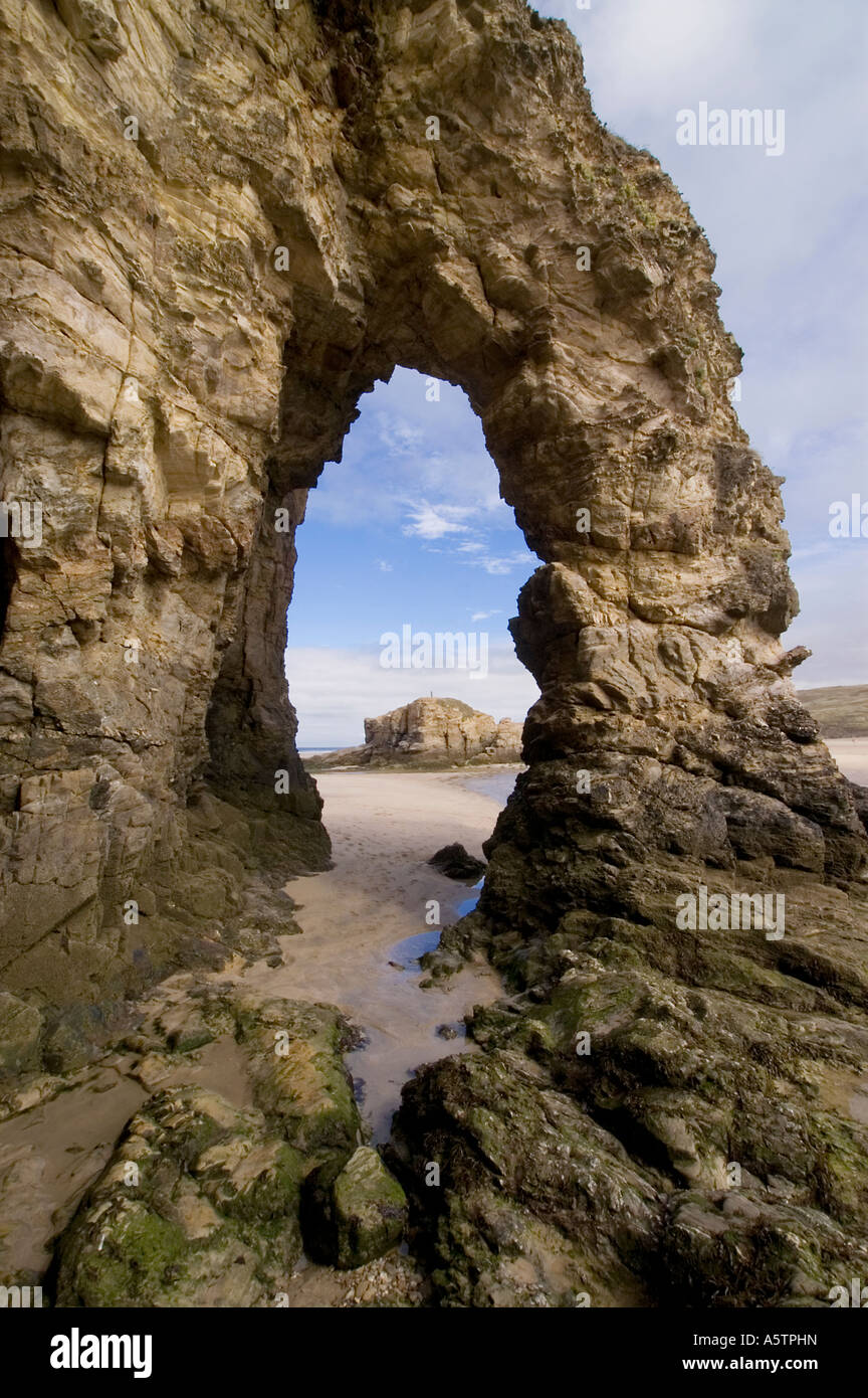 Archway in cliff face, Perranporth, Cornwall UK Stock Photo - Alamy