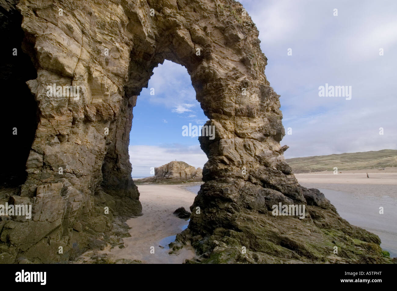 Archway in rocks, Perranporth, Cornwall UK Stock Photo - Alamy