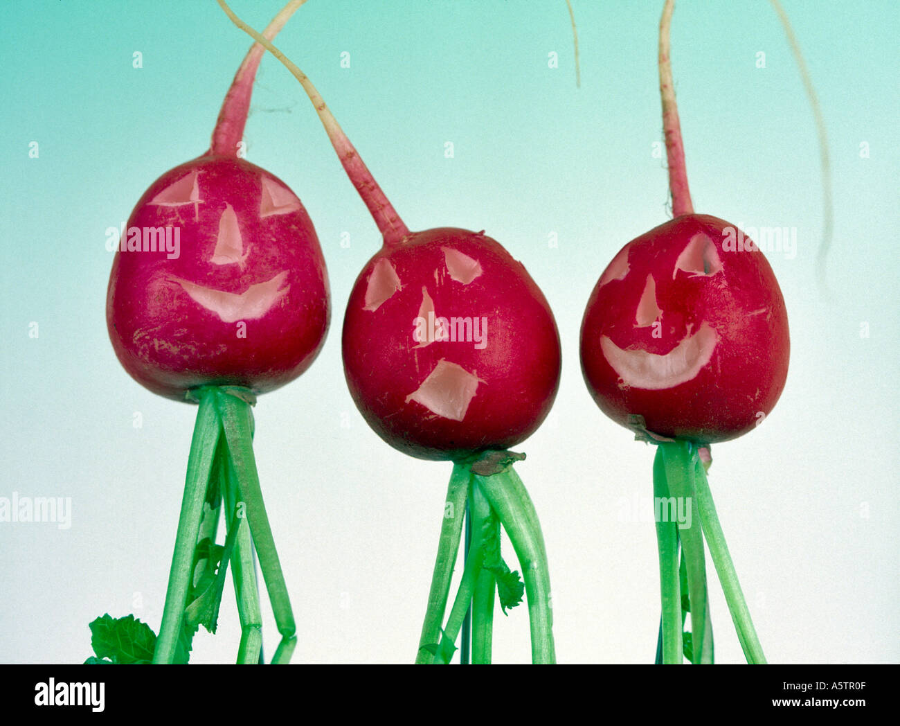 figures made of red small radish Stock Photo - Alamy