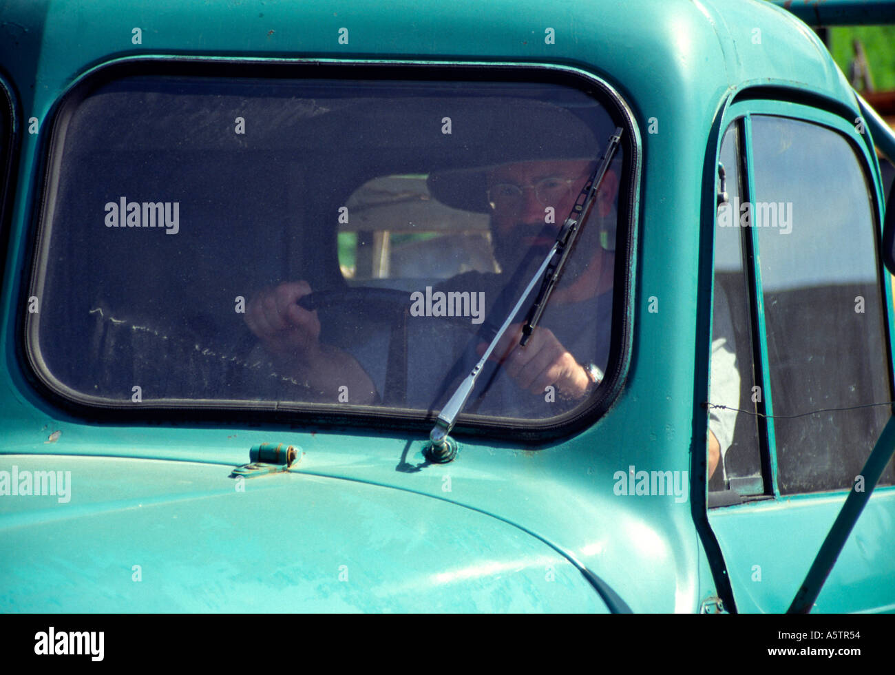 MR man at a wheel of an oldtimer lorry Stock Photo - Alamy