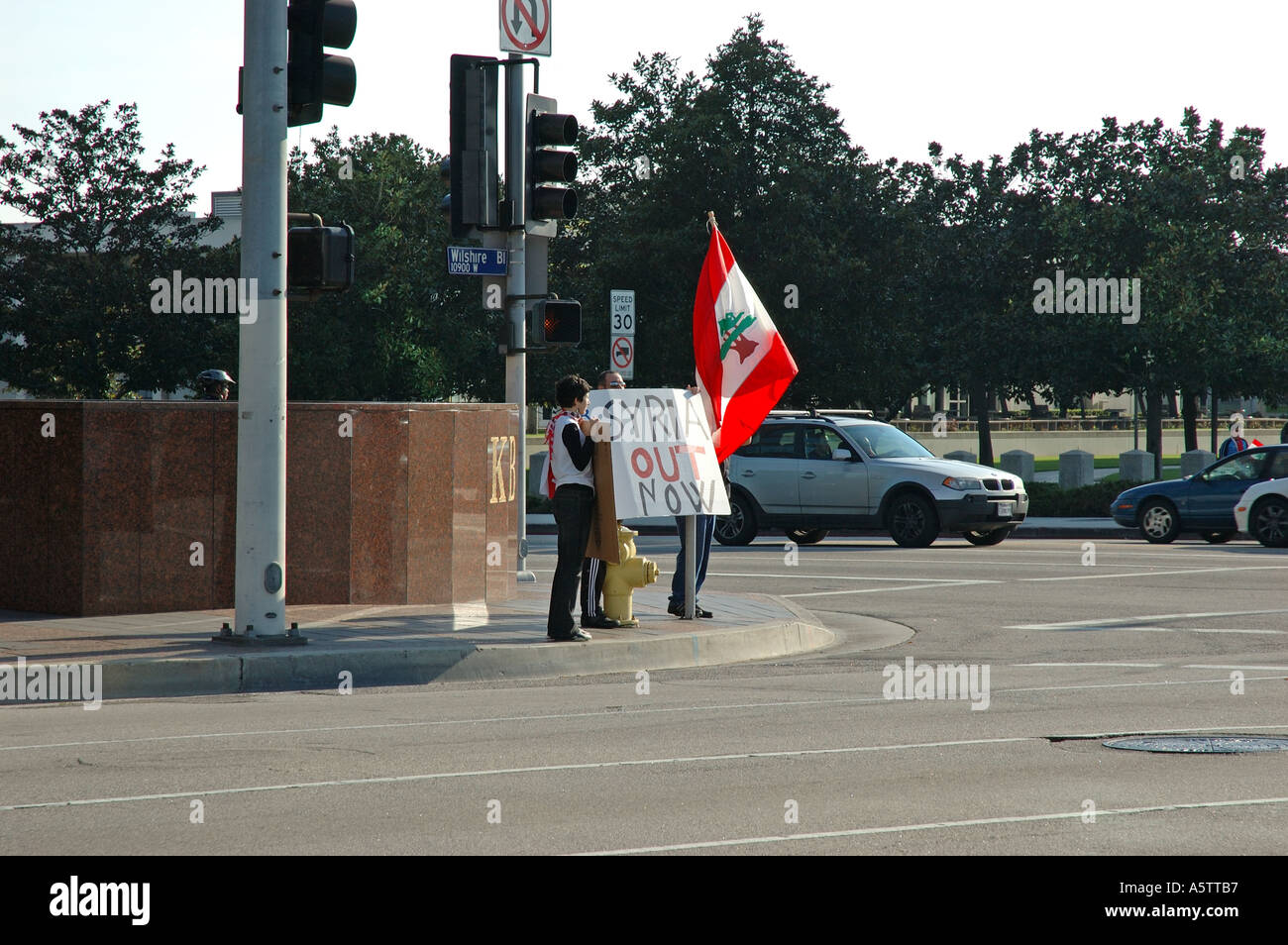 Protesters on Wilshire Blvd in Los Angeles with signs reading Syria Out ...