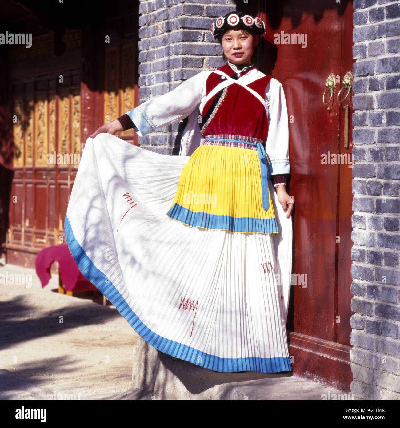 local young naxi woman in traditional clothes by town squarel yunnan ...