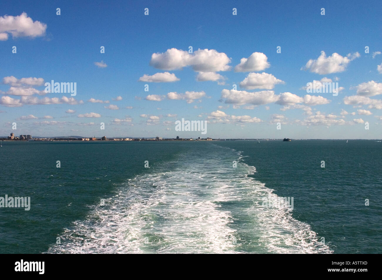 Onboard a ship looking back towards dry land Stock Photo - Alamy