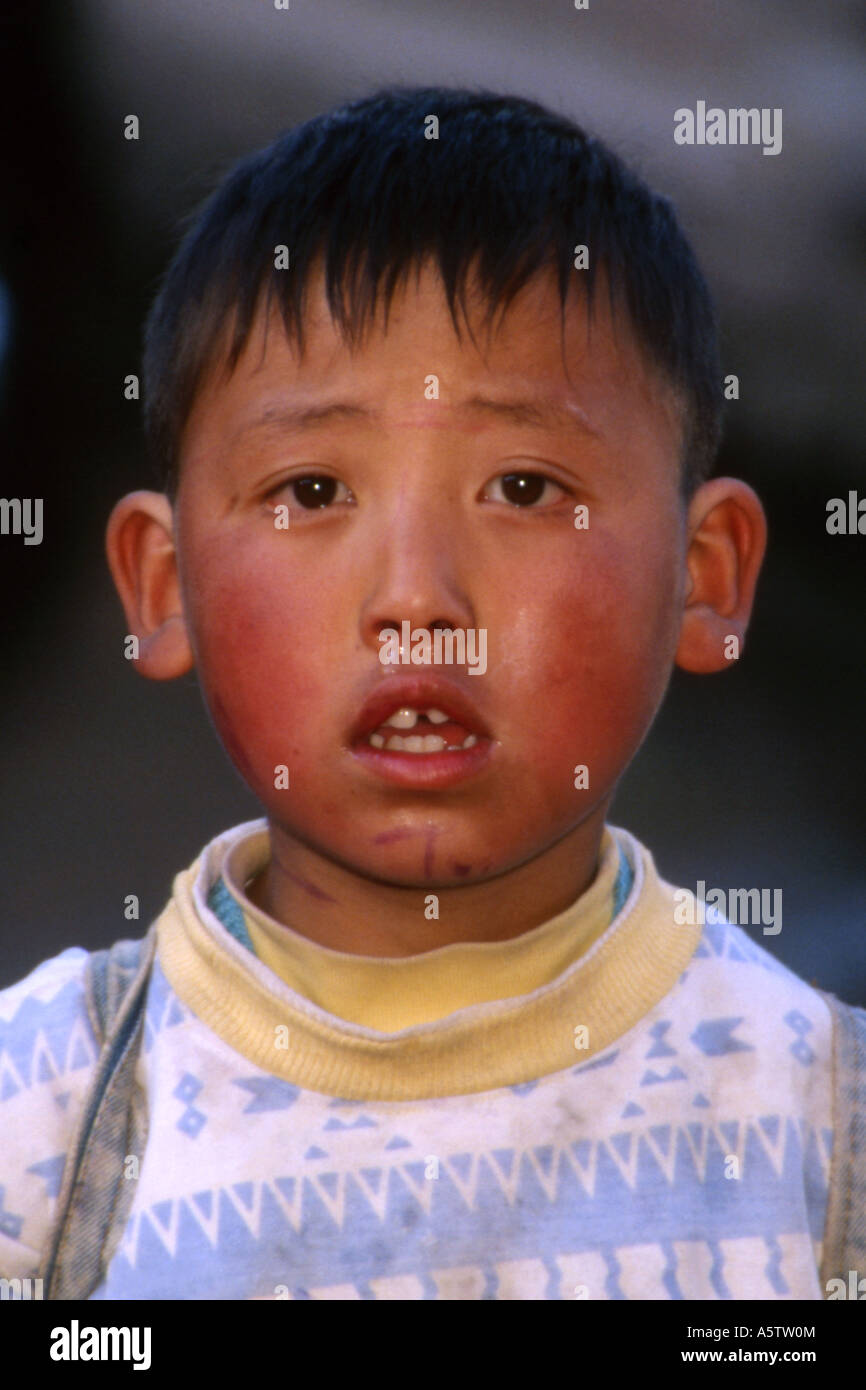 Young,grubby local boy in the street in Chengdu,Sichuan Province,China ...