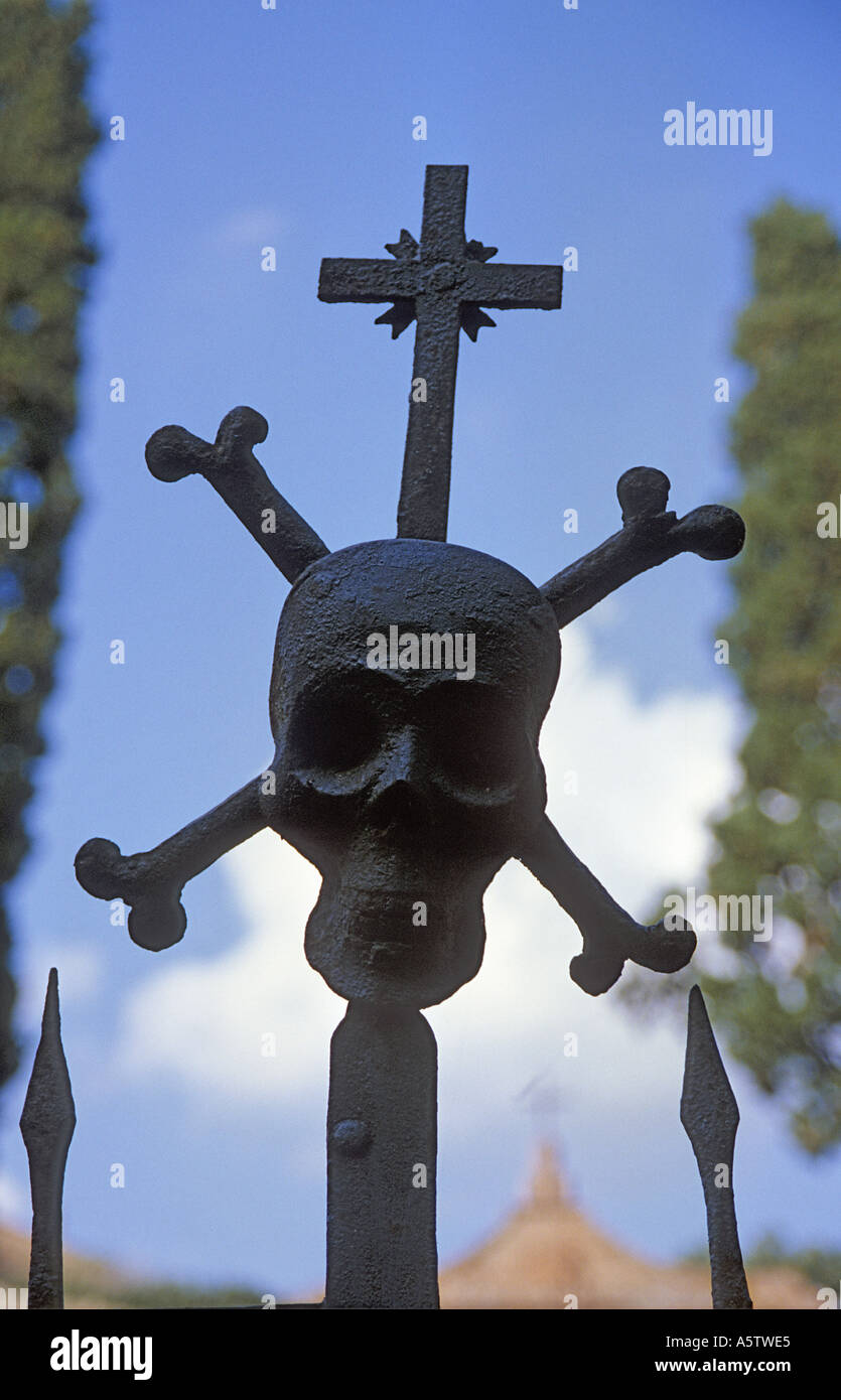 Iron skull at the gate of a cemetry near Montalcino Tuscany Italy Stock ...