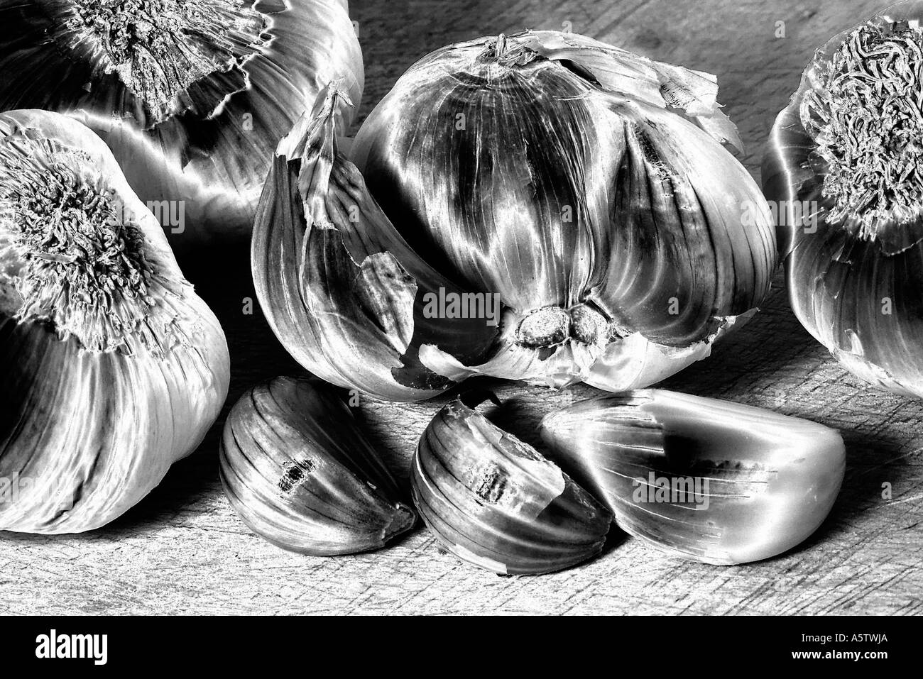 Solarization image of Garlic on cutting board in black and white Stock ...